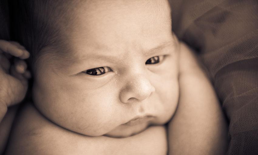 SampsonLaura_060-Baby portrait of a frowning newborn | White Room Studio